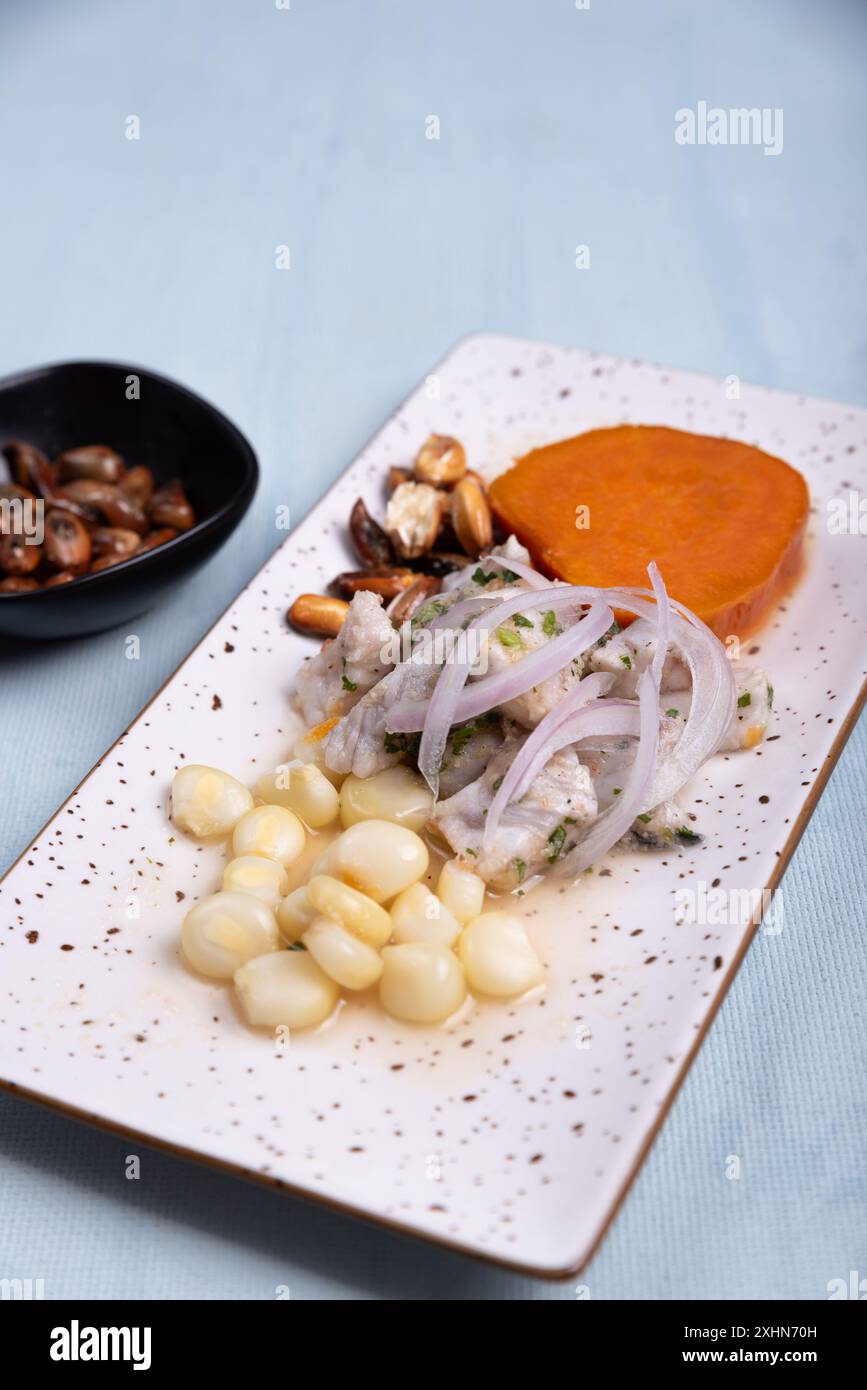 Traditional Peruvian dish called Ceviche presented with a portion of ...