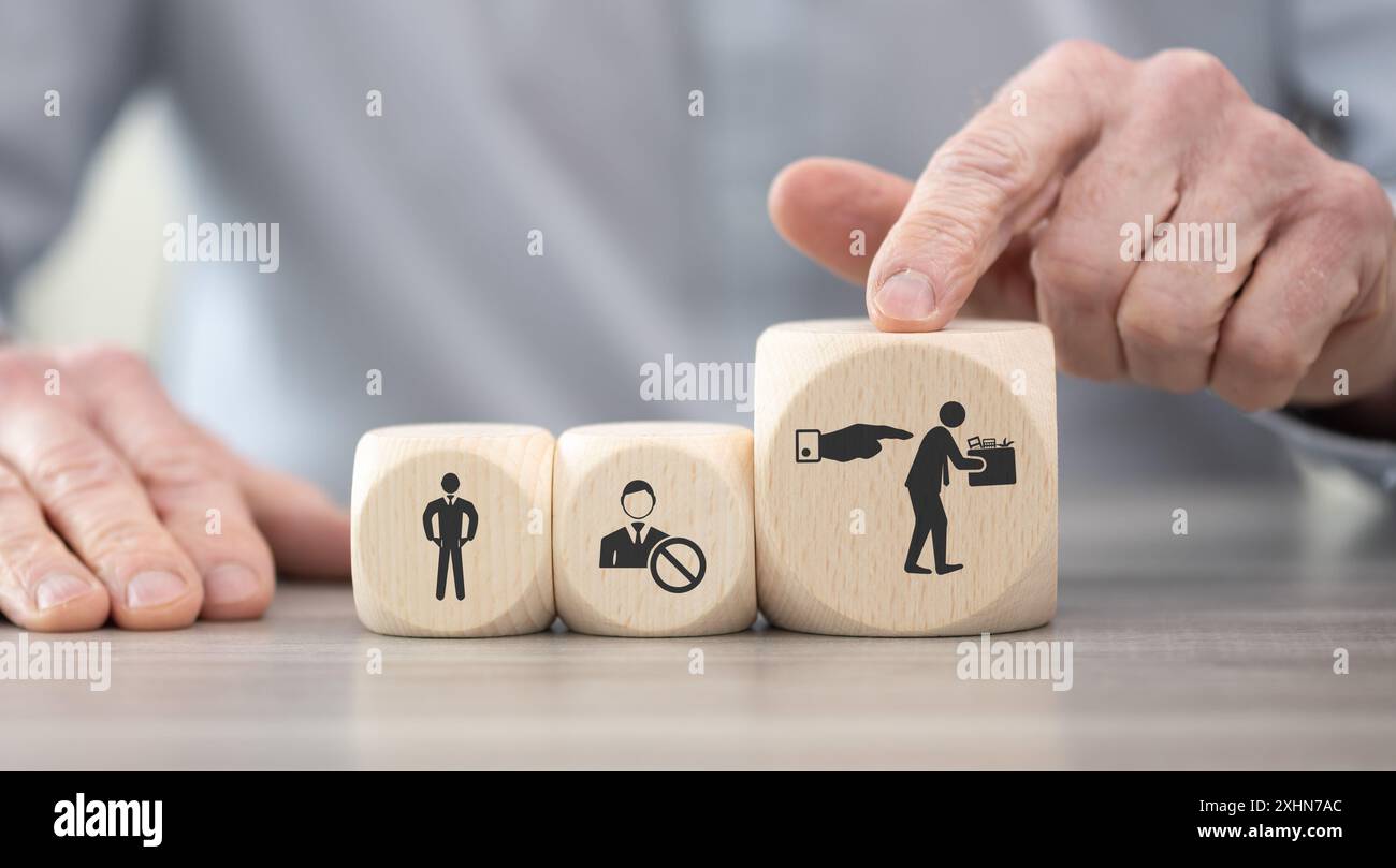 Wooden blocks with symbol of job loss concept Stock Photo - Alamy