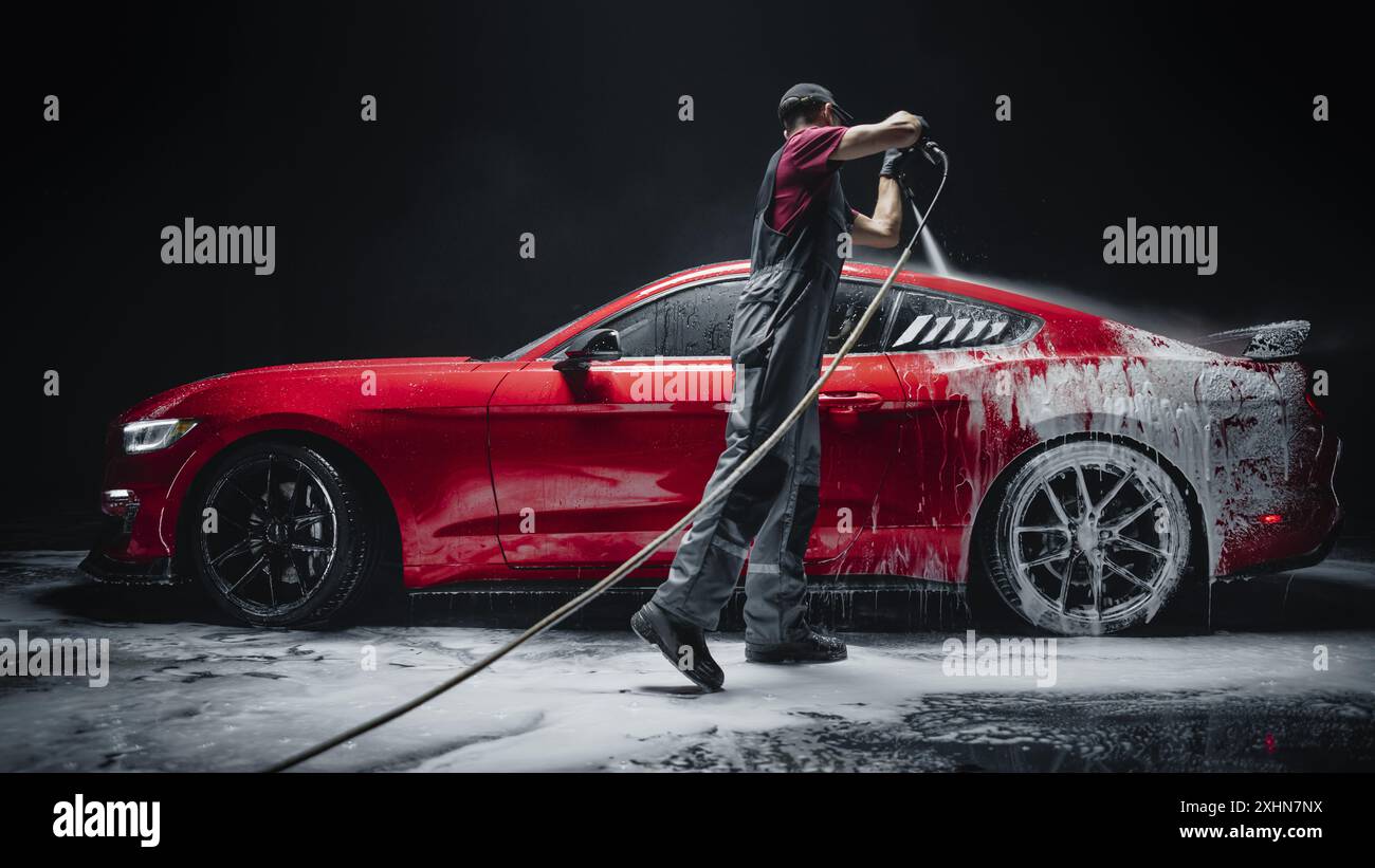 Car Wash Specialist Using Pressure Washer to Rinse a Red Modern ...
