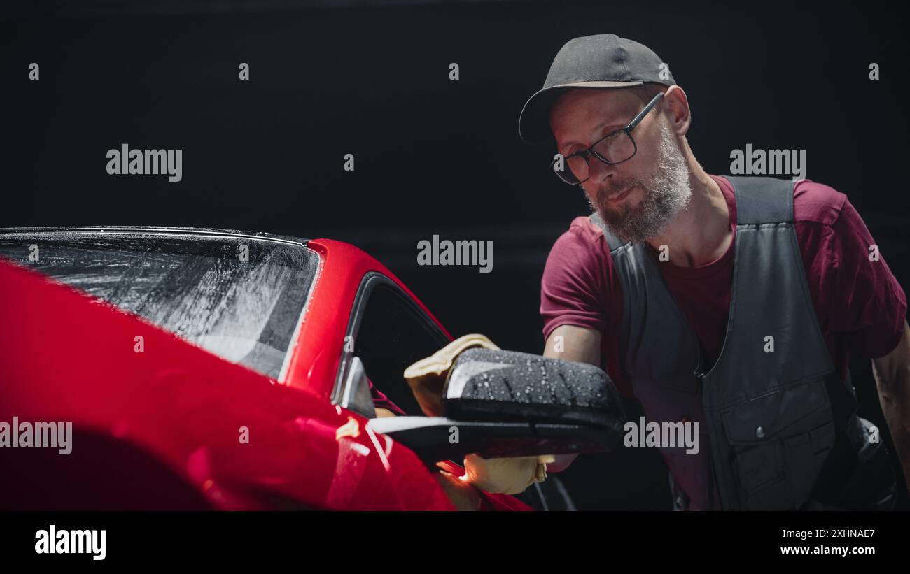 Car detailer cleaning red hood hi-res stock photography and images - Alamy
