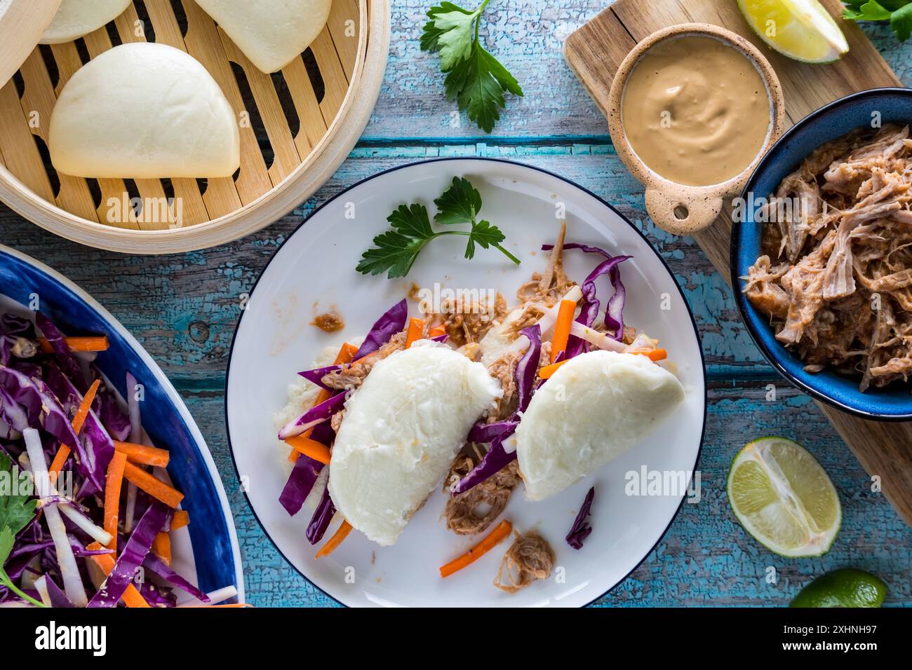 A serving of pulled pork stuffed and steamed bao buns, ready for eating ...