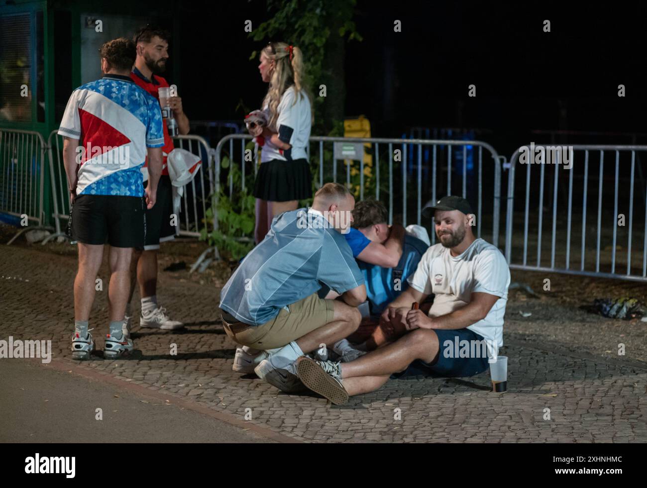 sad england fans leave berlin Stock Photo - Alamy