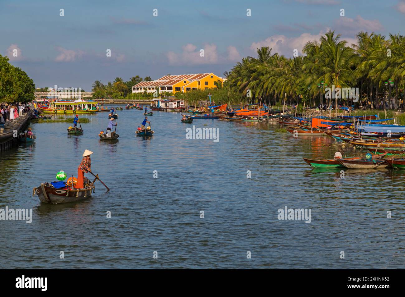 traditional Vietnamese fishing boats going along Thu Bon River at Hoi ...