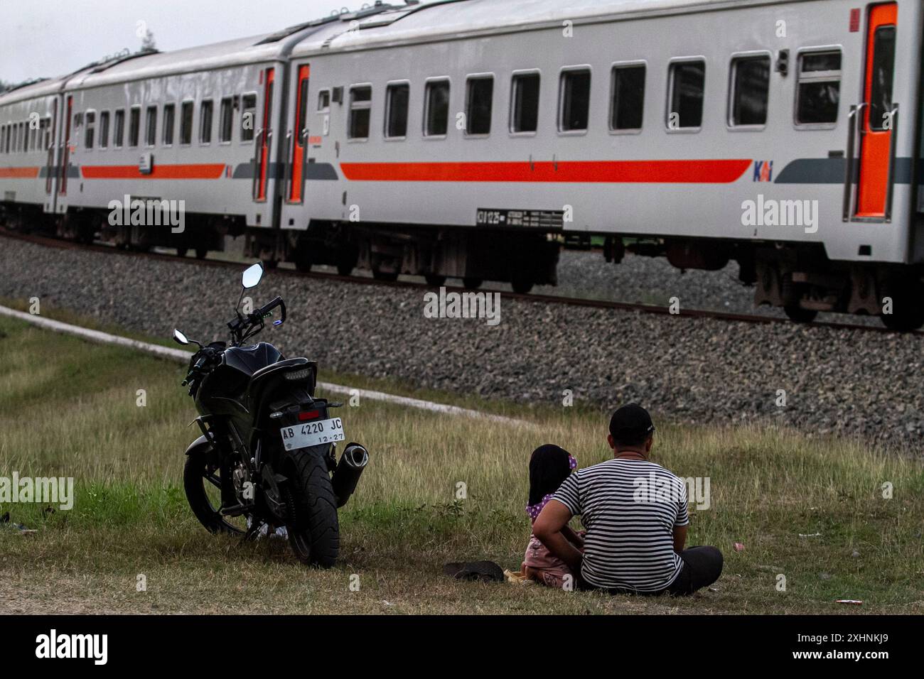 Kulon Progo, Yogyakarta, Indonesia. 15th July, 2024. A father and his ...