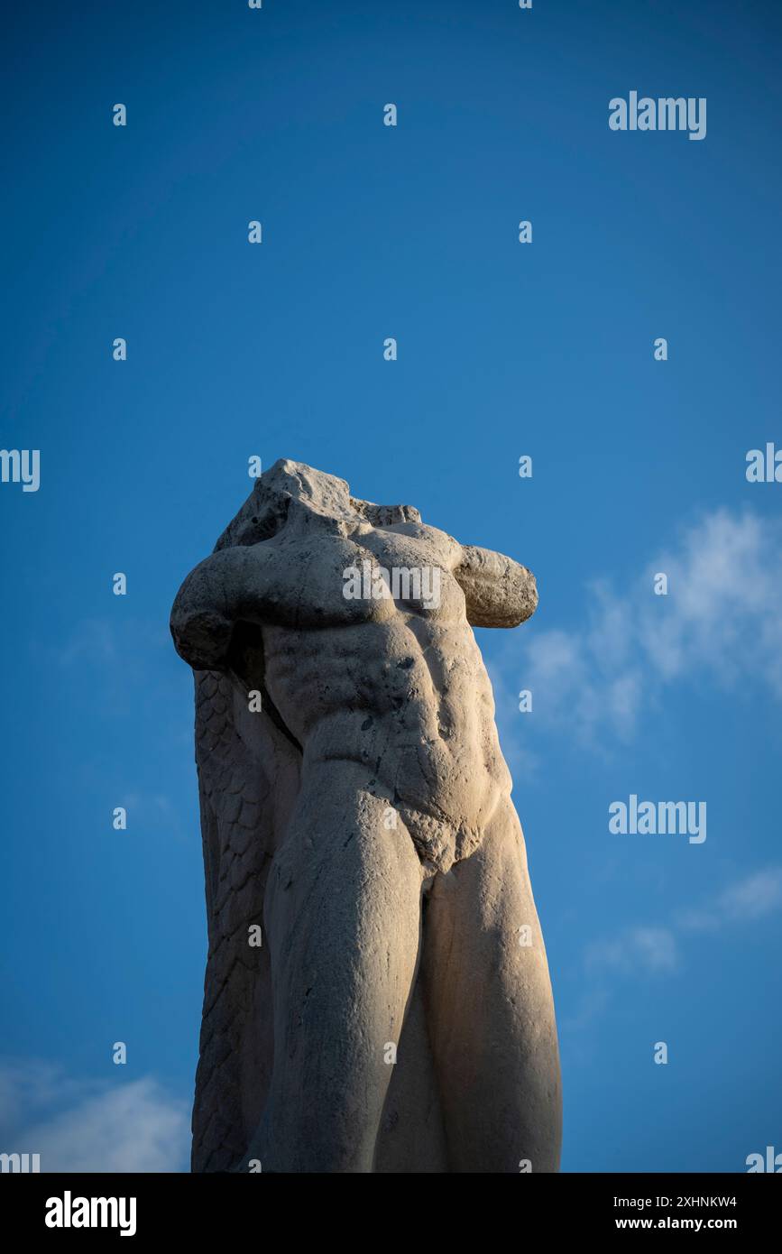 Statue of one of the Giants at the entrance to Odeon of Agrippa ...