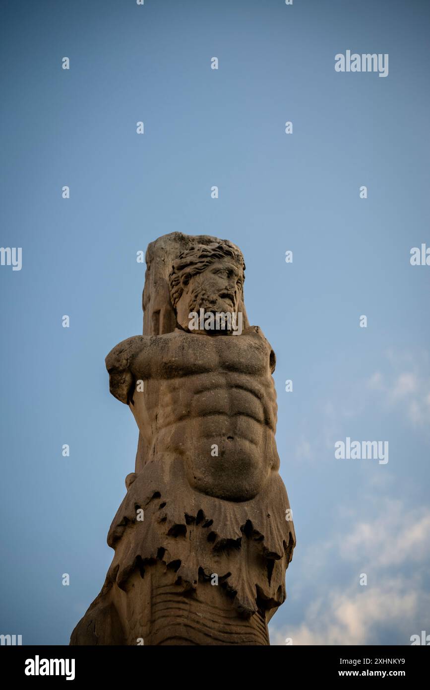 Statue of one of the Giants at the entrance to Odeon of Agrippa ...