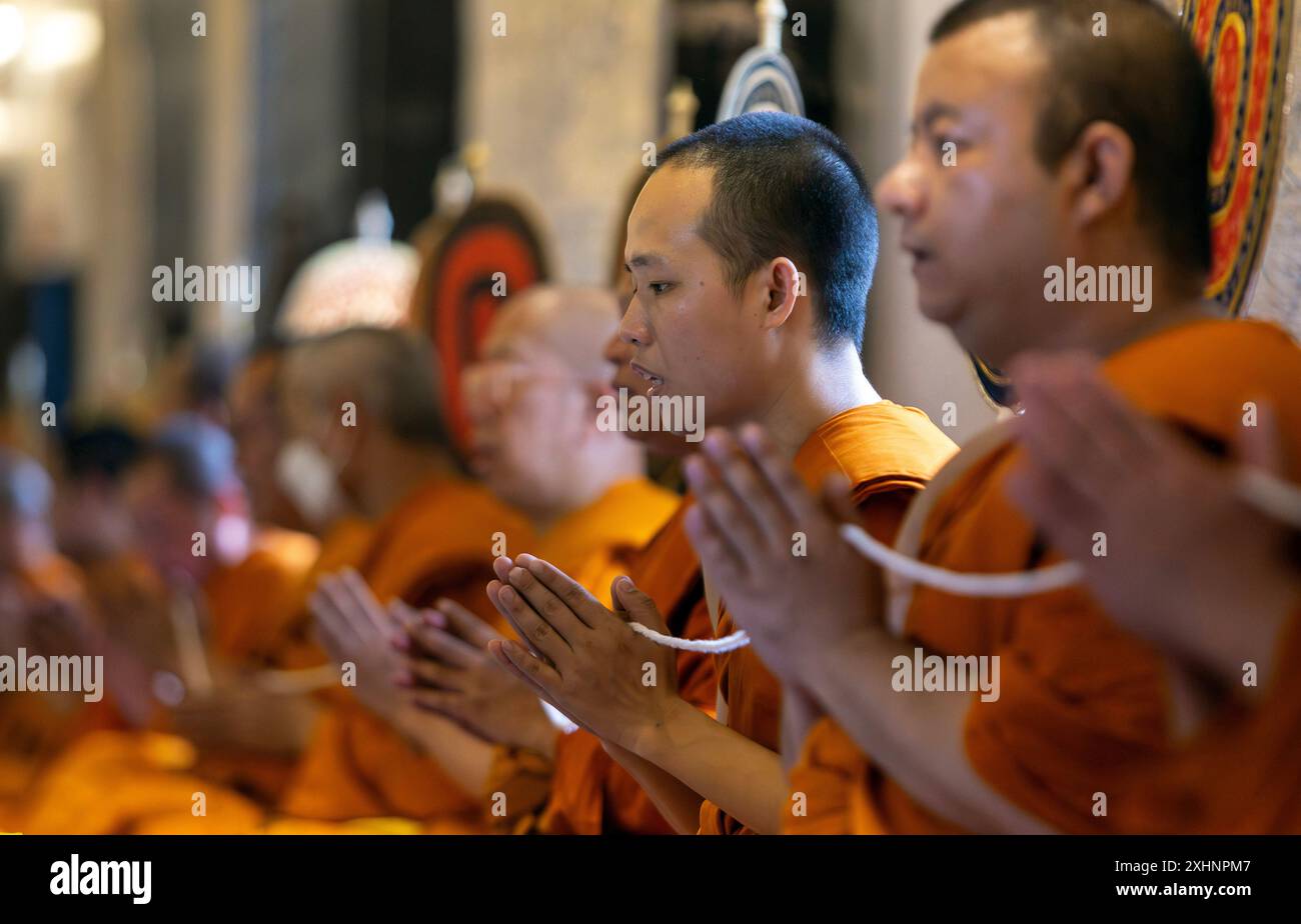 Chiang Mai, Thailand. 15th July, 2024. Thai monks chant prayers in the ...