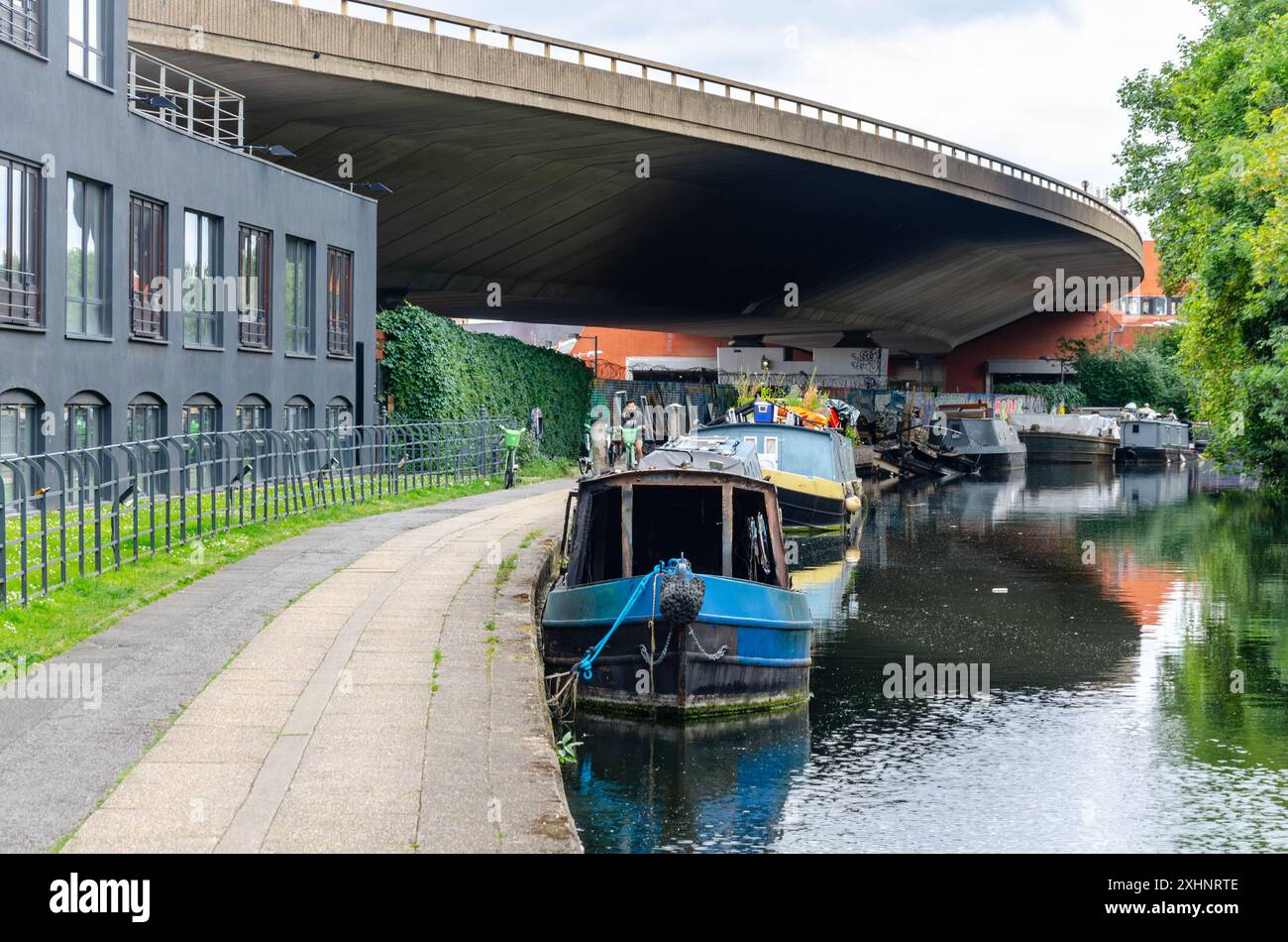 A burnt out, fire damaged narrowboat on The Grand Union Canal ...