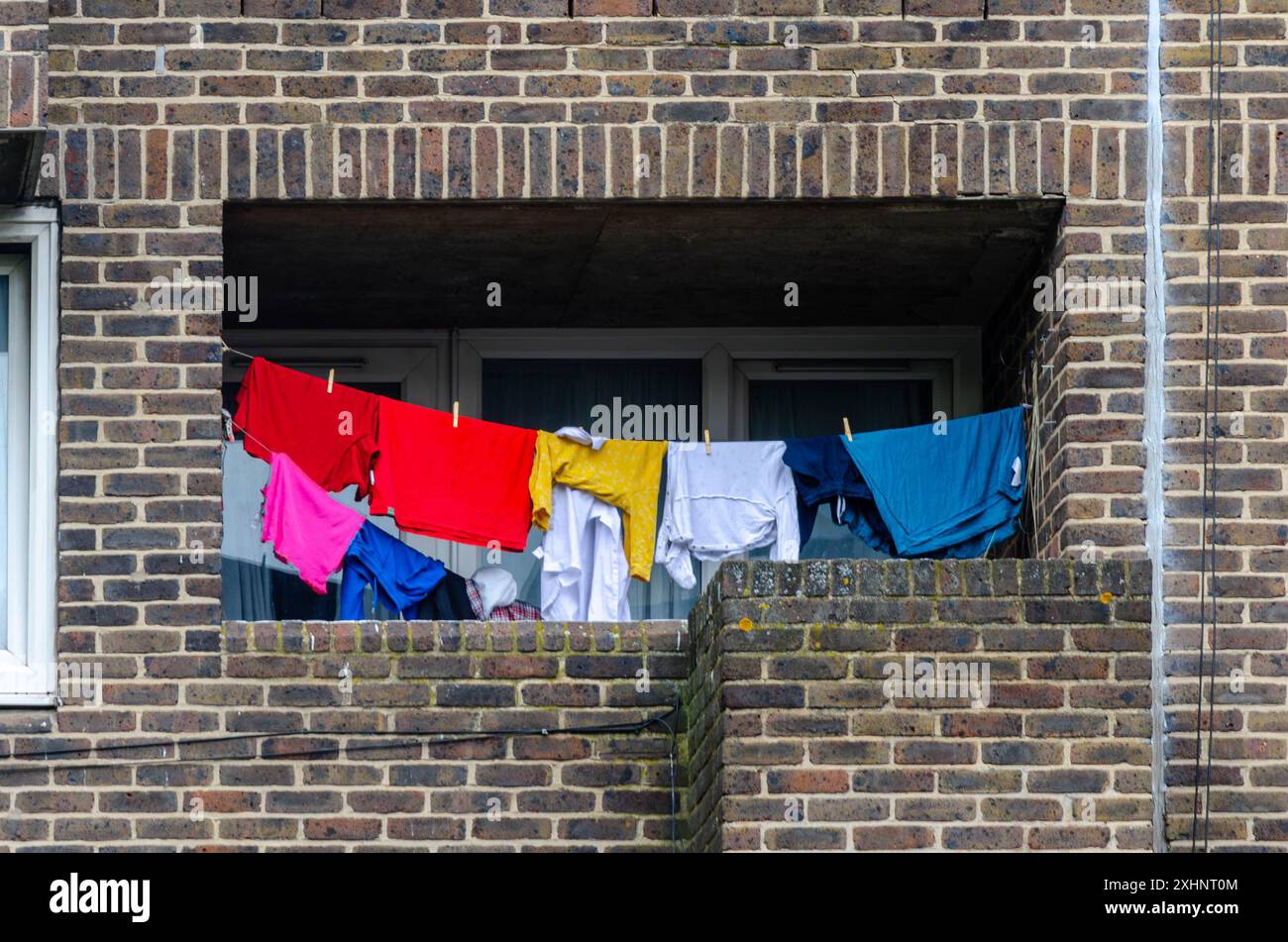 Washing drying on a washing line on a balcony belonging to a flat in a ...