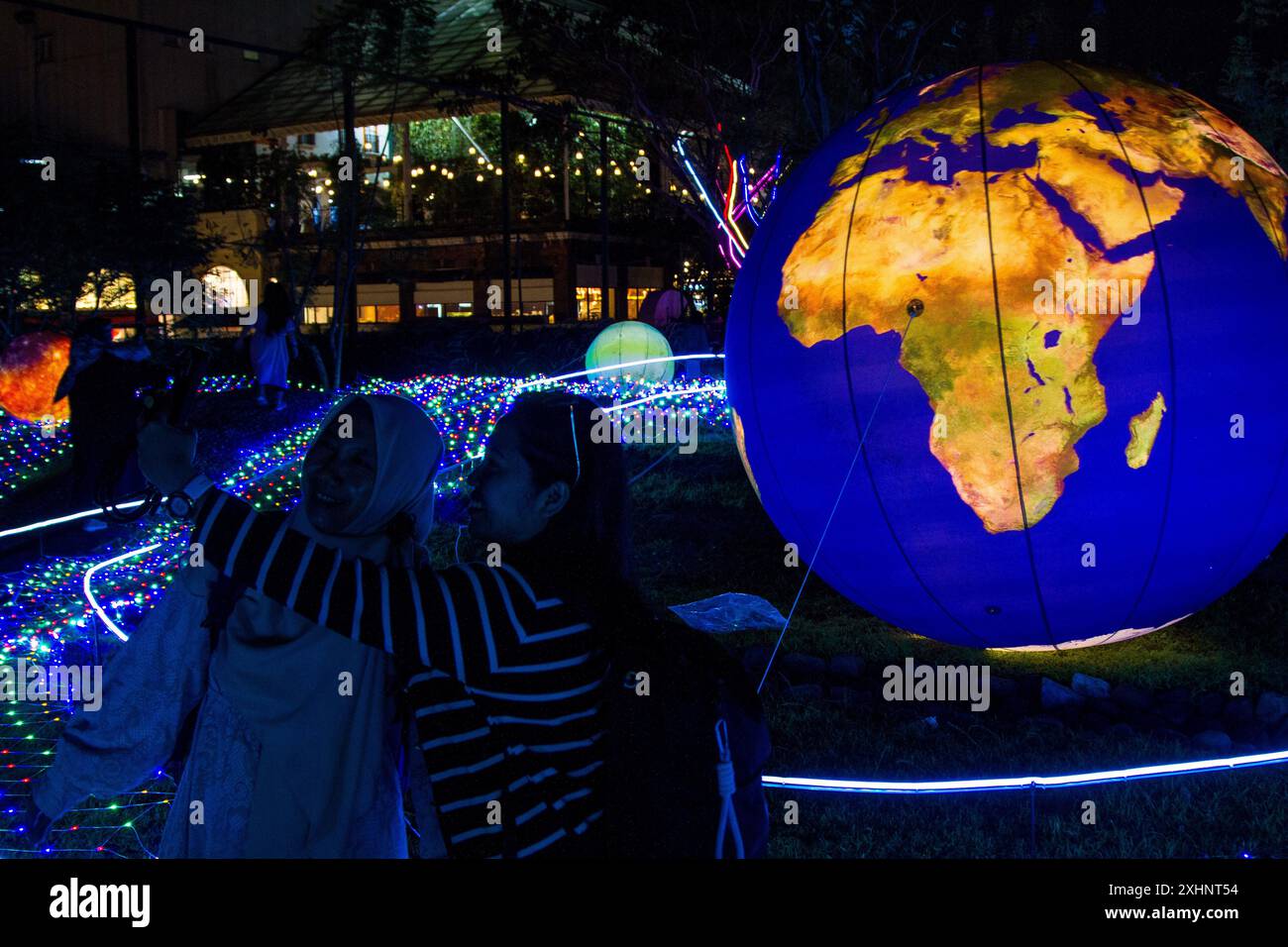 Bandung, West Java, Indonesia. 15th July, 2024. People take a photo at ...