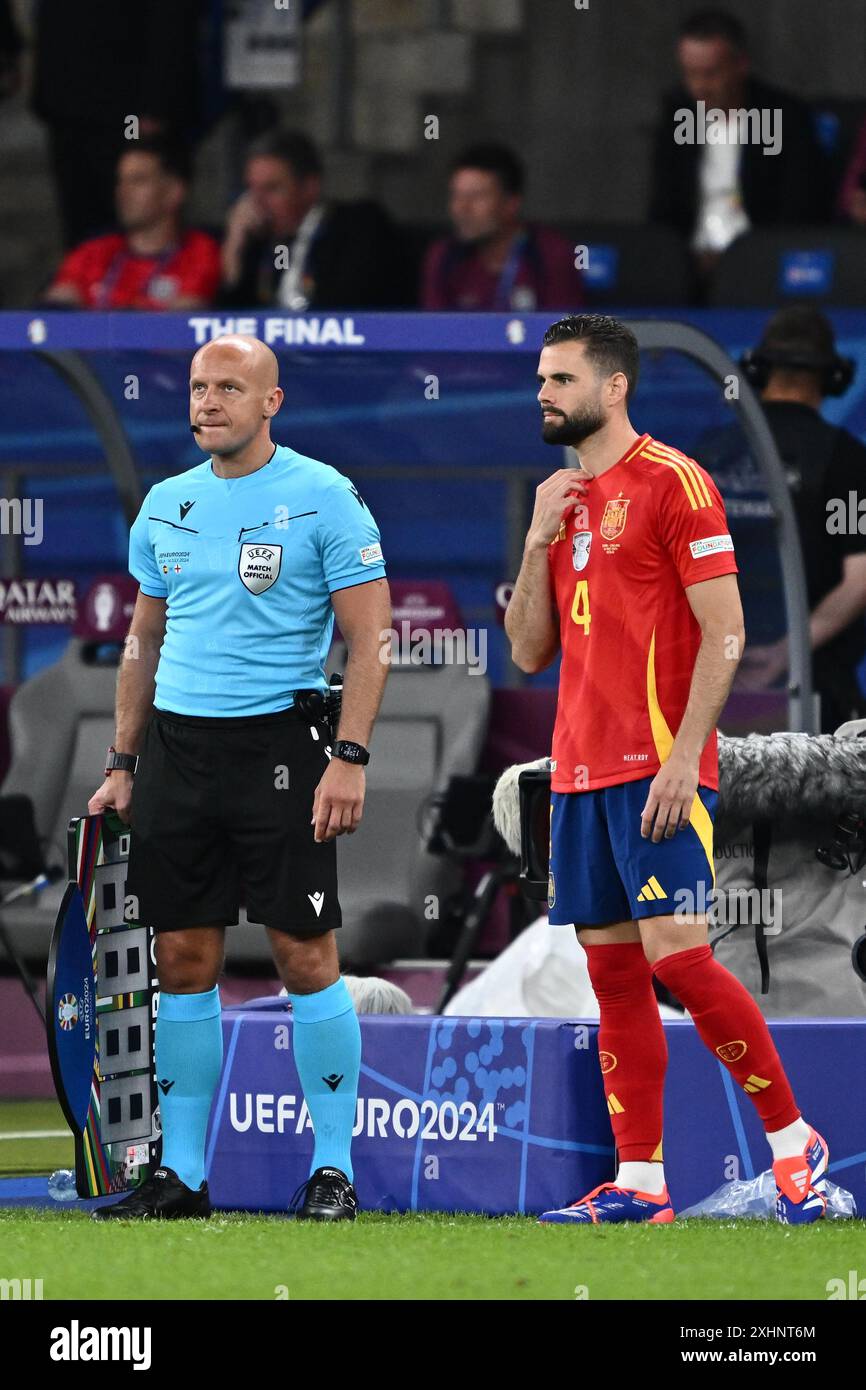 BERLIN, GERMANY - JULY 14: Szymon Marciniak, referee and Nacho of Spain ...