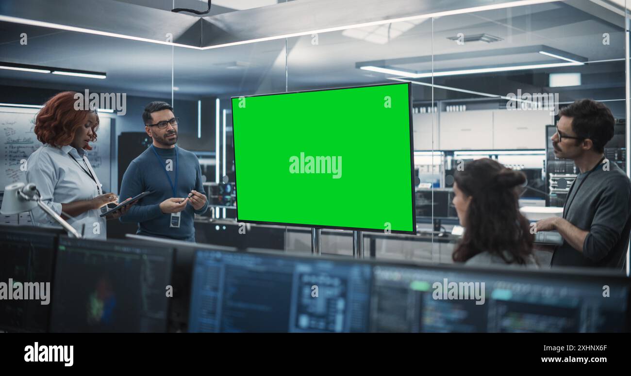 Group of Multiethnic Software Developers Having a Meeting in a Conference Room with Green Screen ...