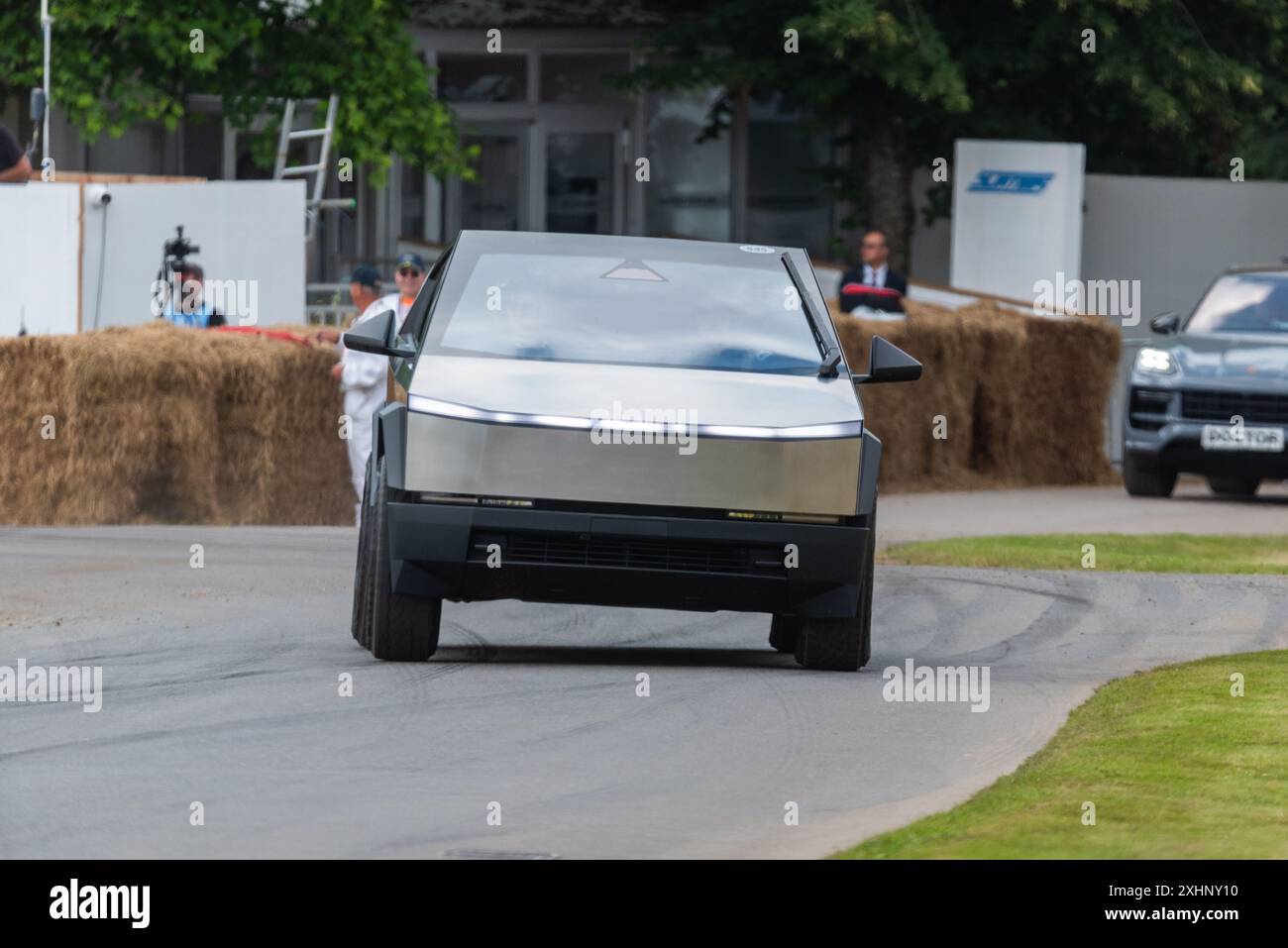 Tesla Cybertruck electric pickup truck driving up the hill climb track ...