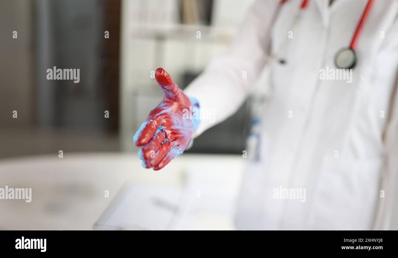 Doctor in white gown giving bloody hand for handshaking Stock Photo - Alamy
