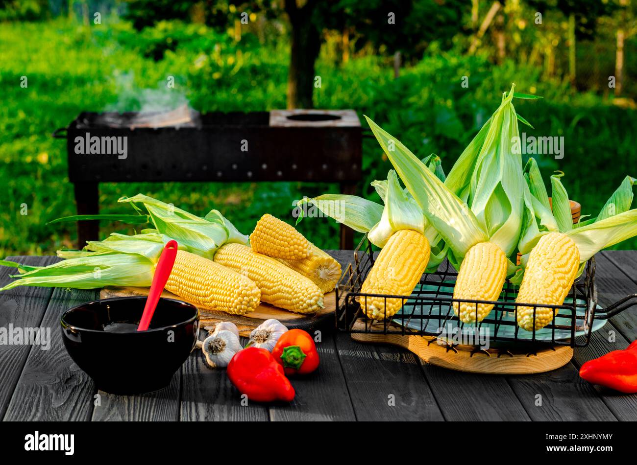 Picnic in the garden. Sweet baby corn on a grill Stock Photo - Alamy