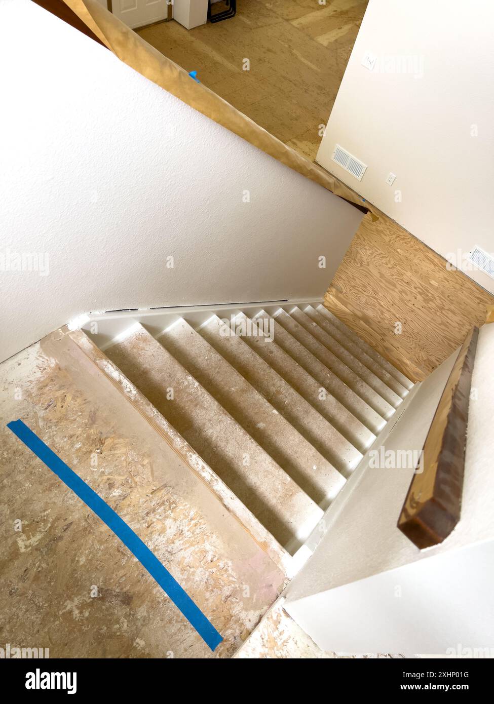 Staircase Under Renovation with Unfinished Steps and Protective ...