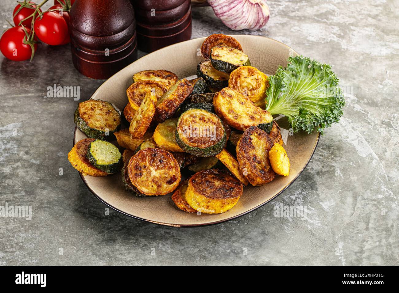 Roasted young zucchini snack in the plate Stock Photo - Alamy