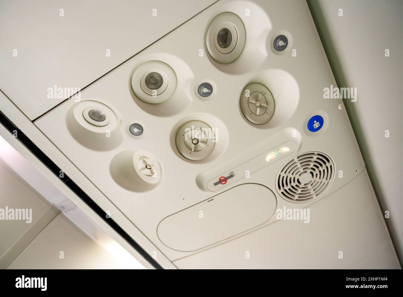 Air conditioning on an airplane and a flight attendant call button ...