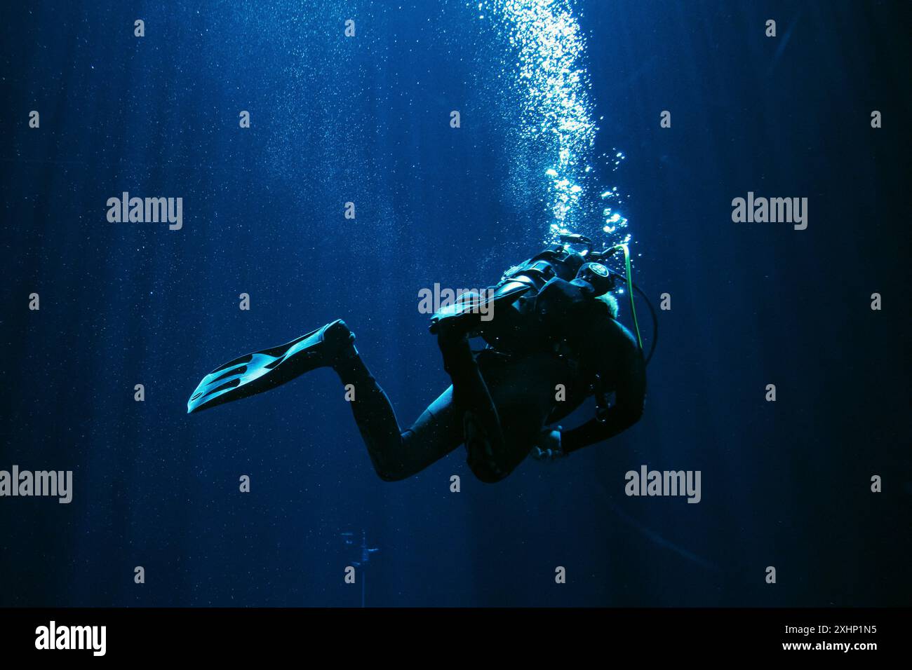 Diver swimming in the blue water with the aqualun Stock Photo - Alamy
