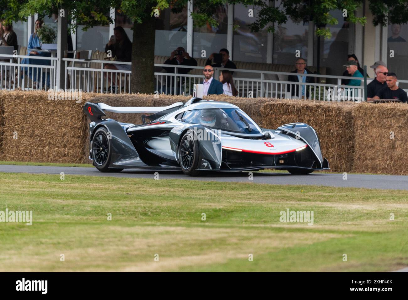 Mika Hakkinen driving a McLaren Solus GT sports car up the hill climb ...