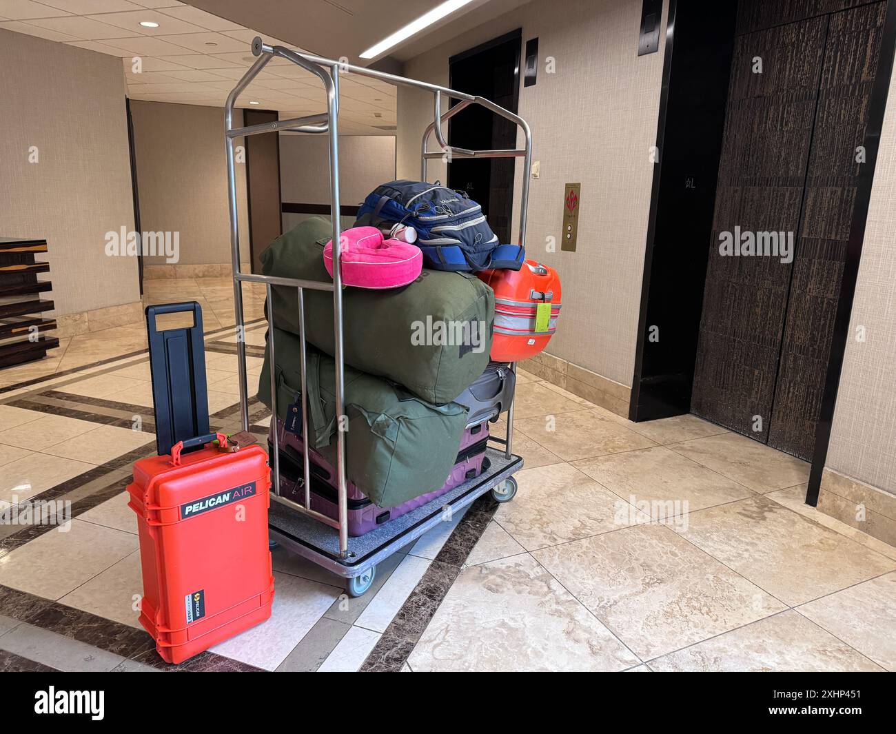Dallas, Texas - March 16, 2024: Luggage cart filled with suitcases and ...