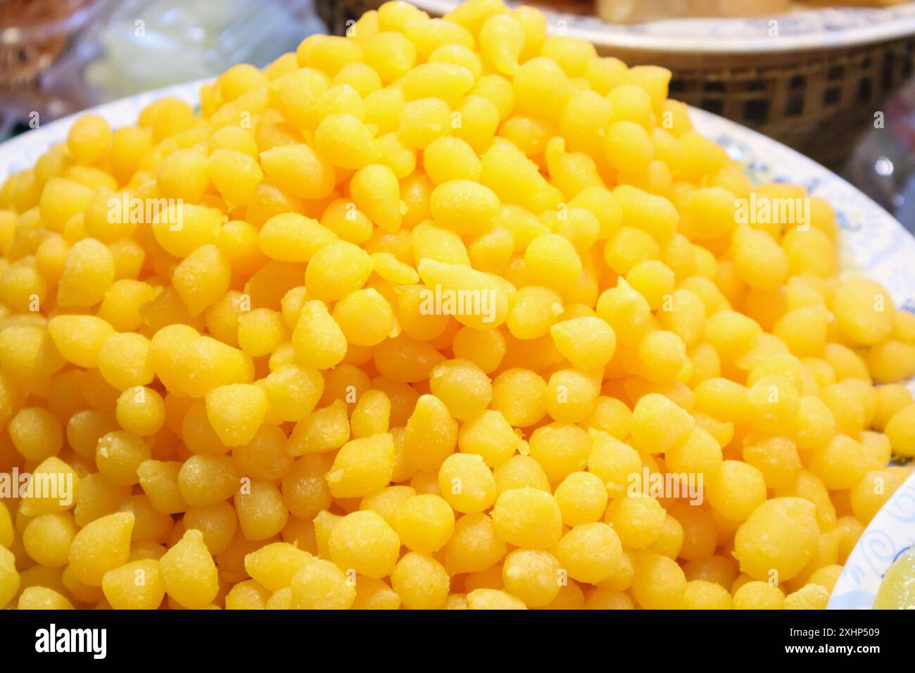 Thai sweet dessert egg yoke fudge balls, golden color Stock Photo - Alamy