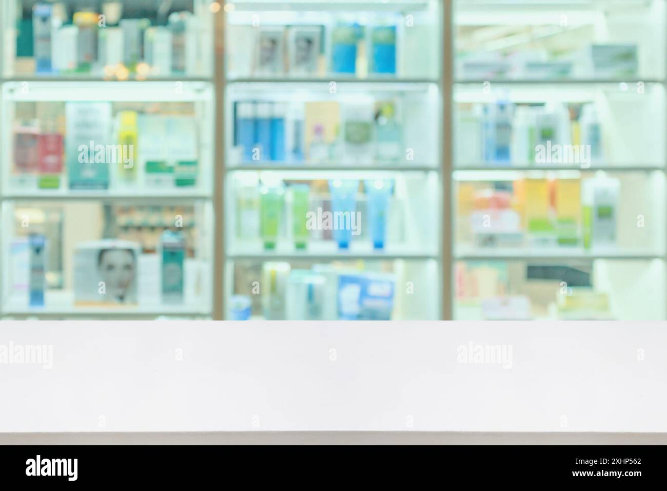 Pharmacy counter with medicines healthcare product arranged on shelves ...