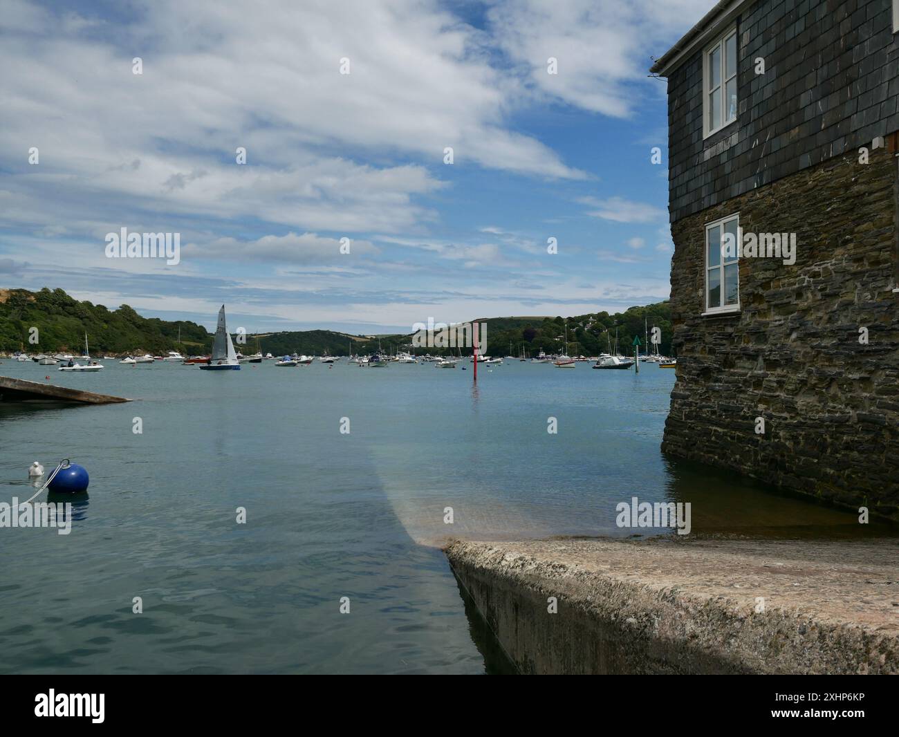 Family fun people enjoy crabbing off jetty in Salcombe, South Hams ...