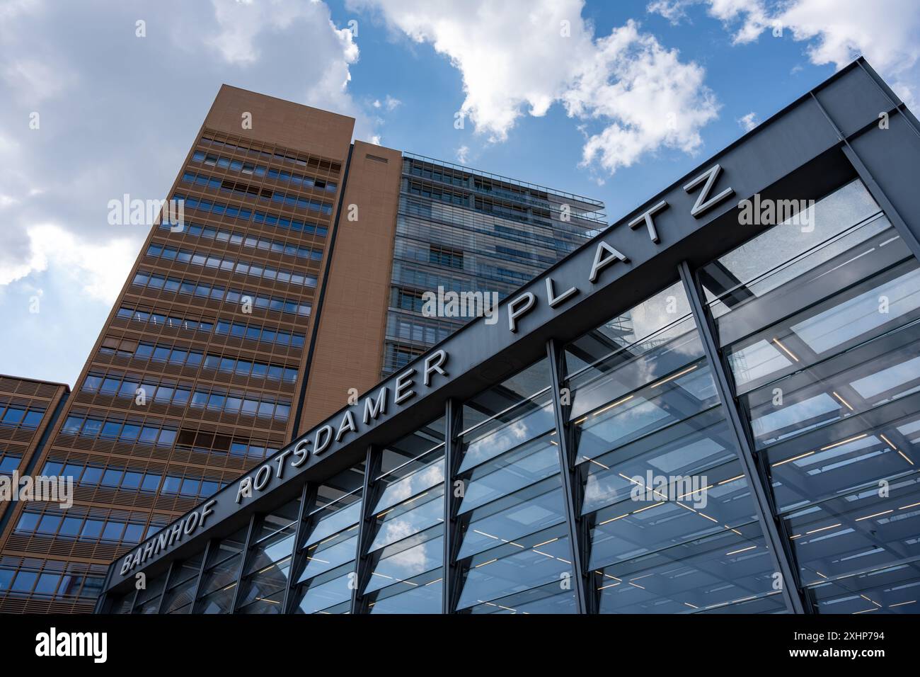 A large building with a glass facade and the words Bahnhof Potsdamer ...
