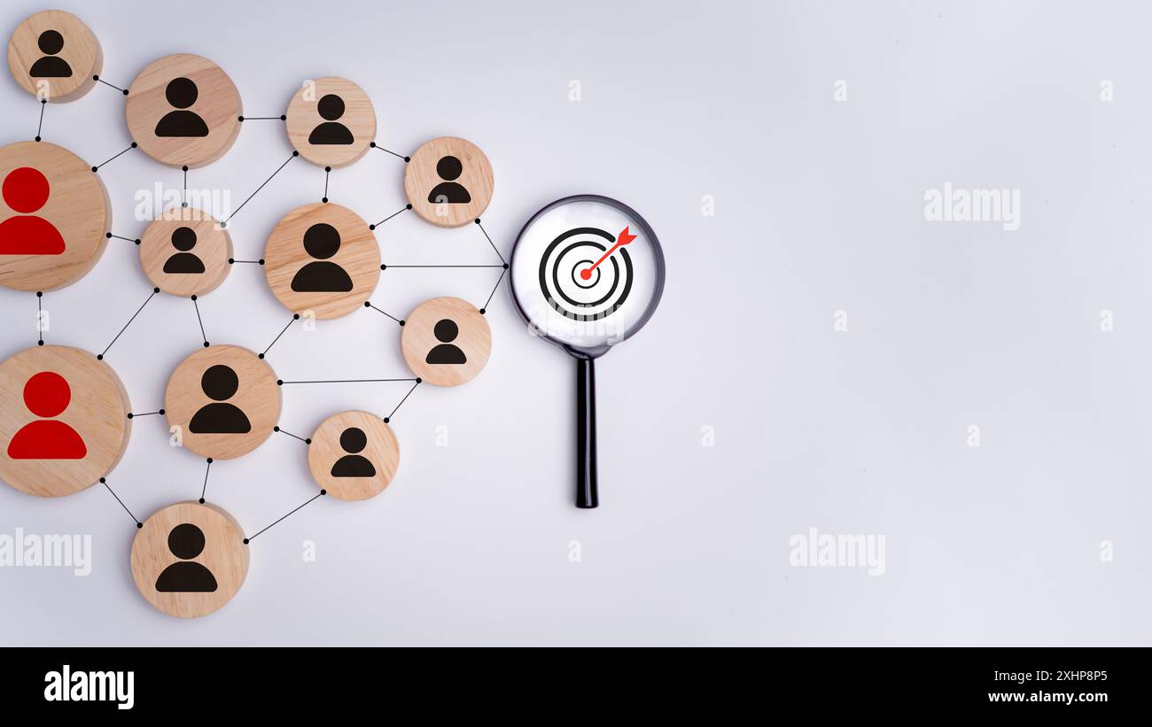 Wooden block with target icon linked with human icons for customer ...