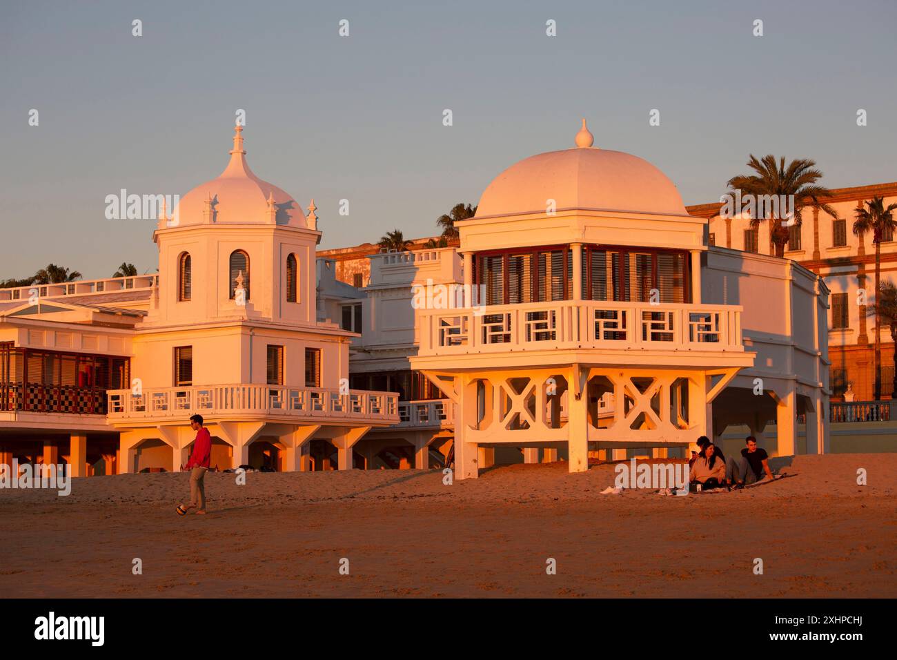 Spain, Andalusia, Cadiz, La Caleta beach, young people on the sand of ...