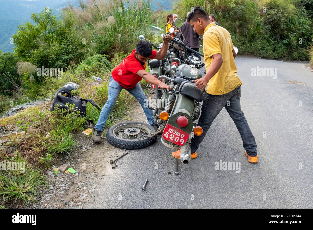 Nepal, Kathmandu valley, repairing a puncture during a motorcycle raid ...