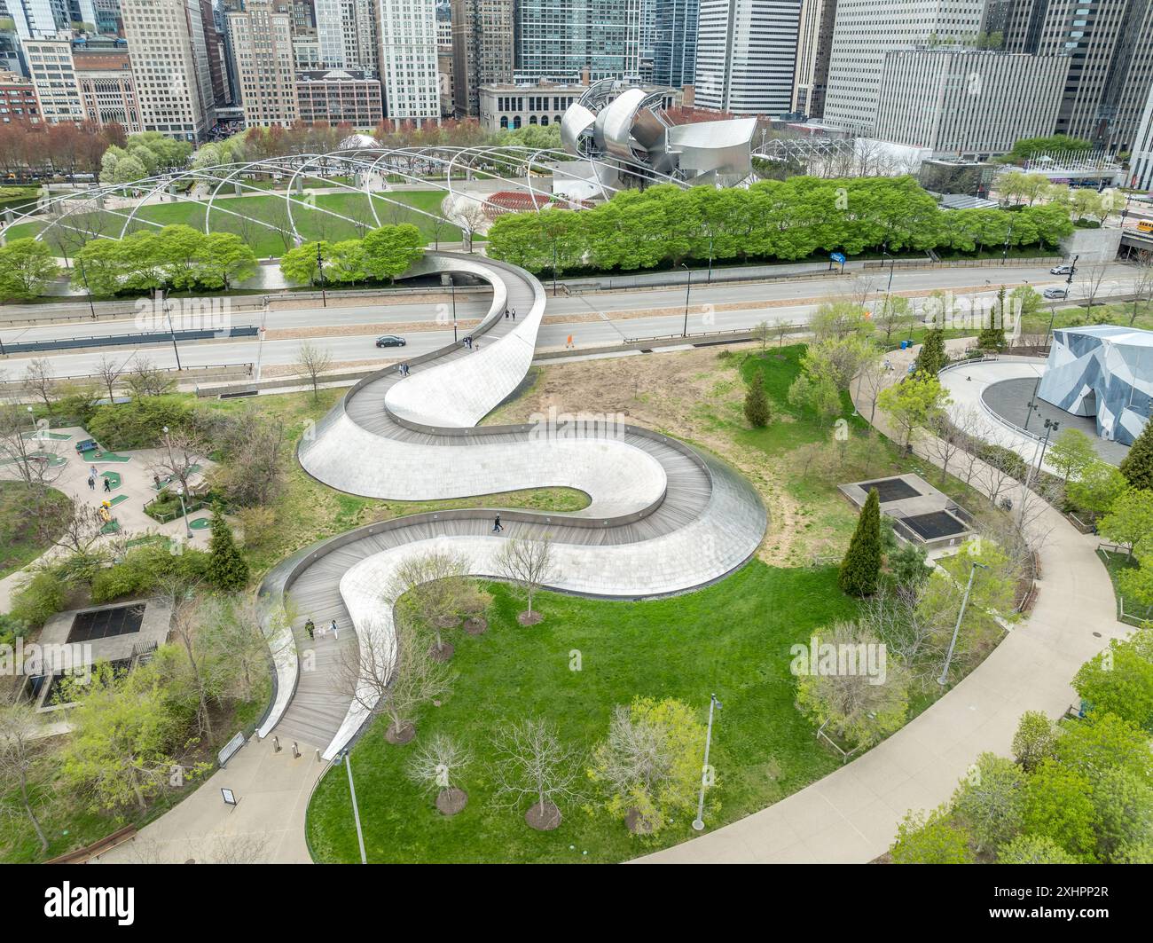 Winding pedestrian bridge with stainless steel panels in Chicago Stock ...