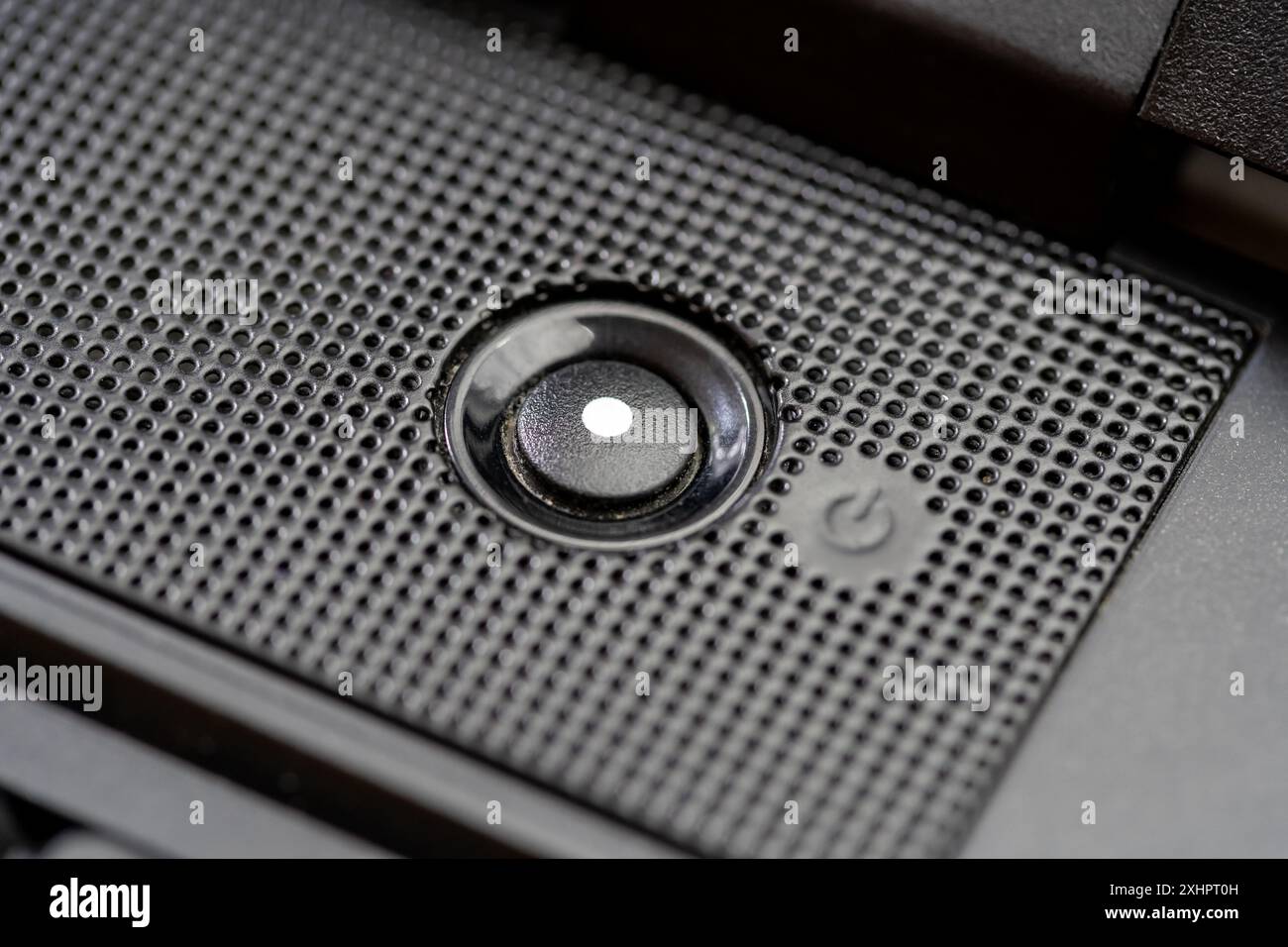 Generic round circle power button light on a modern laptop computer ...