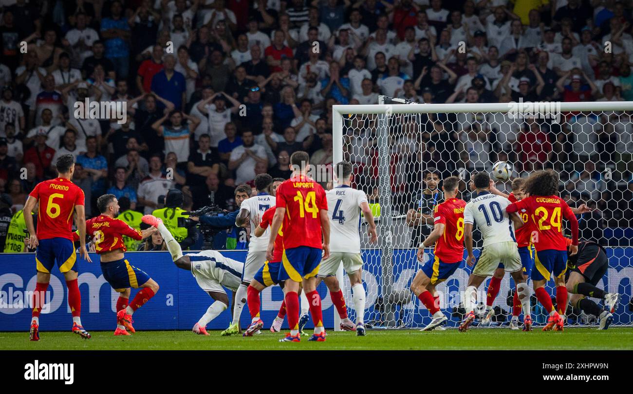 Berlin, Germany. 14th Jul 2024. Dani Olmo (ESP) clears Marc Guehi (ENG ...