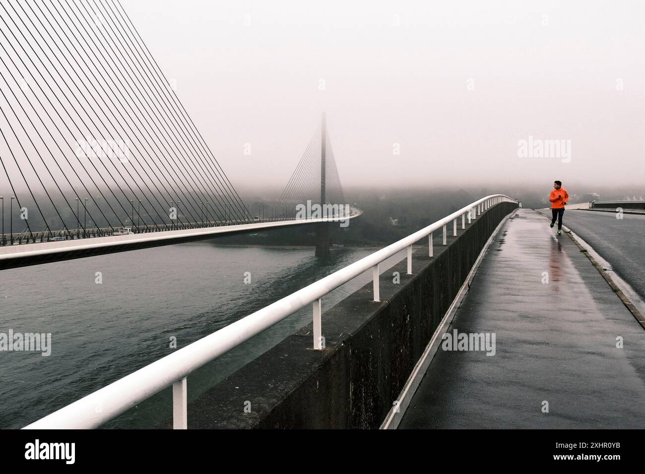 France, Finistere, Brest, man running on the Albert Loupe bridge next ...