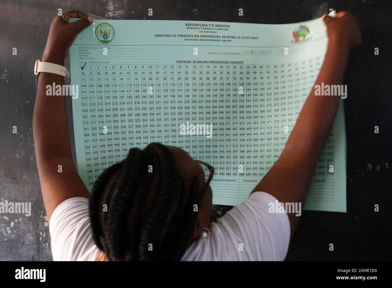 Electoral workers continue to count votes at a polling station in ...