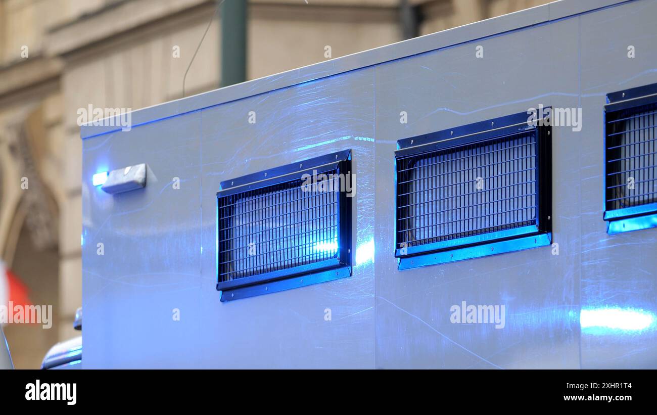 Simple police prisoner transport vehicle protected windows, blue lights ...