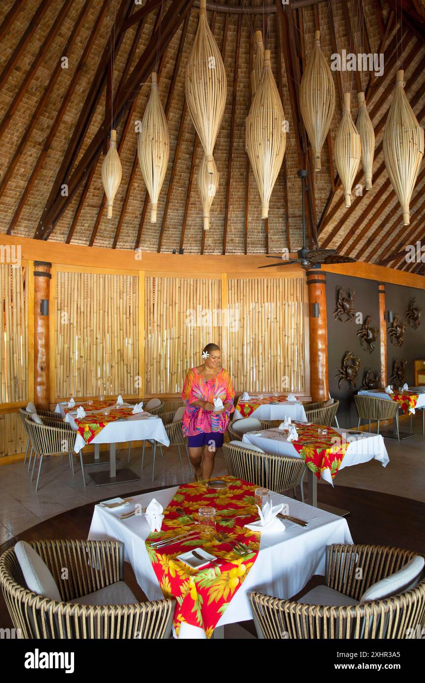 French Polynesia, Bora Bora island, waitress in the wooden design decor ...