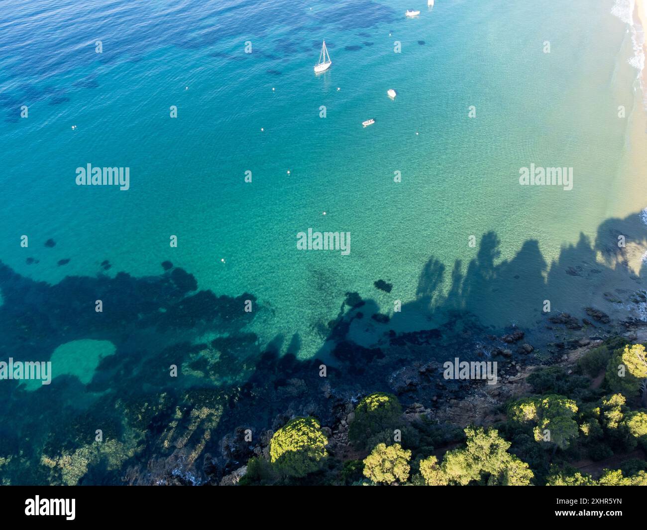 Aerial view on boats, crystal clear blue water of Plage du Debarquement ...
