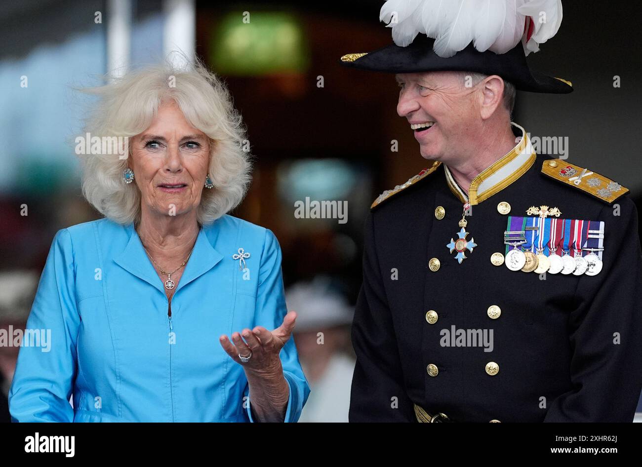 Queen Camilla chats with Lieutenant-Governor of Jersey Vice Admiral Jerry Kyd during the King's ...