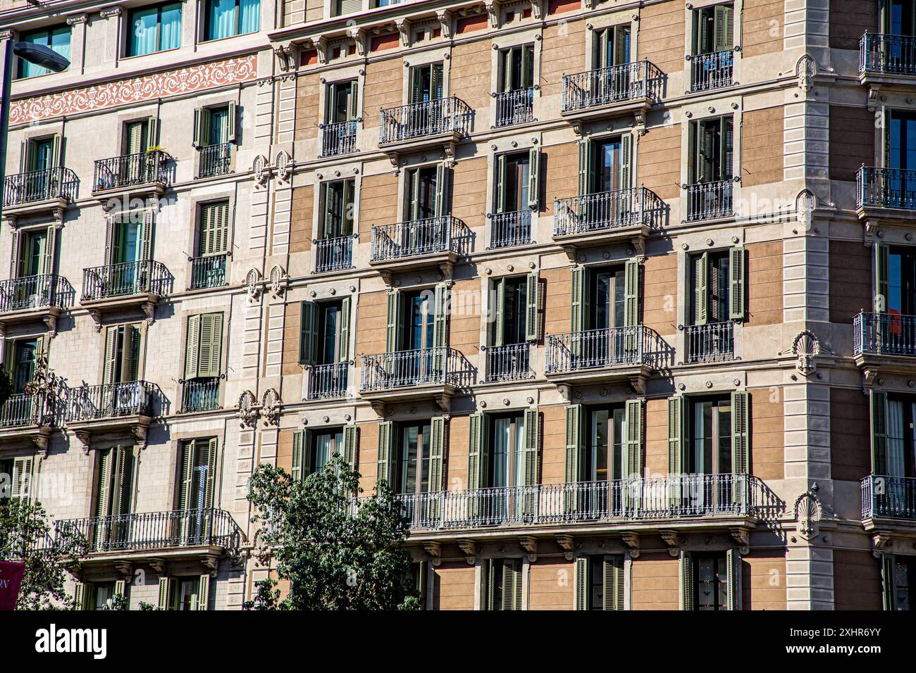 Front facade of an apartment block in Barcelona, Spain, with many ...