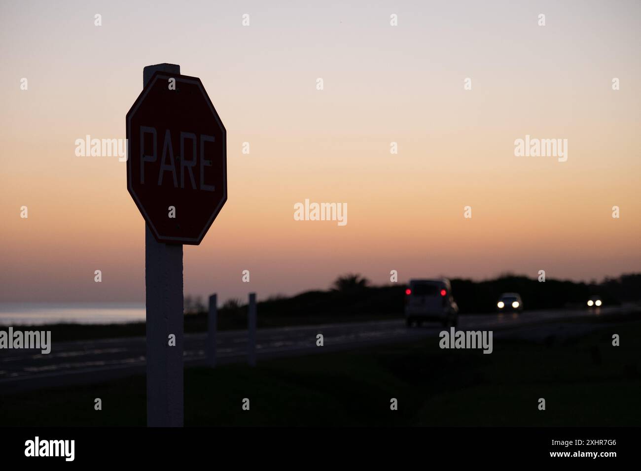 A stop sign with the word PARE (STOP in spanish) written on it. The ...
