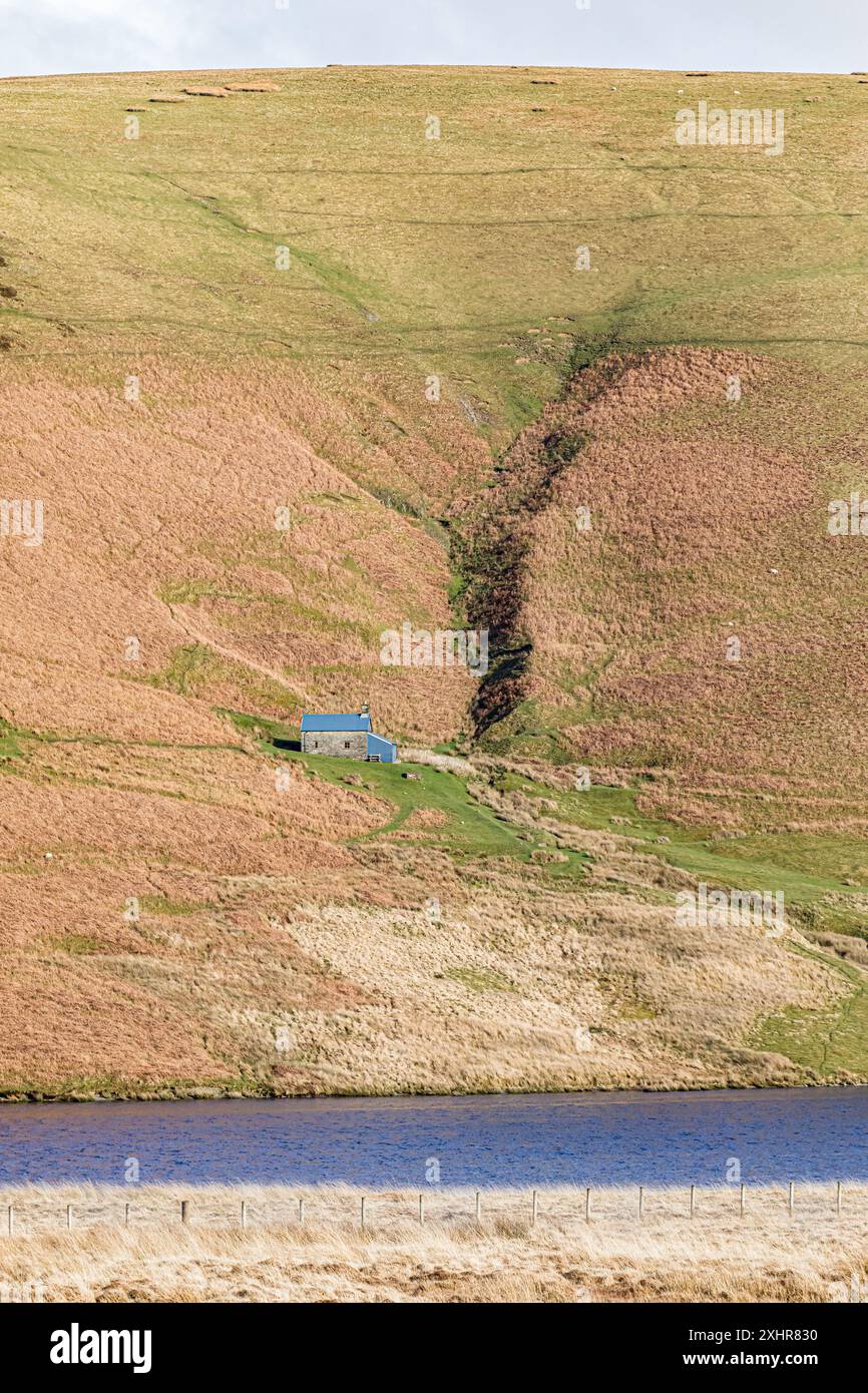 Isolated building high up in empty landscape on hill farm in snowdonia ...