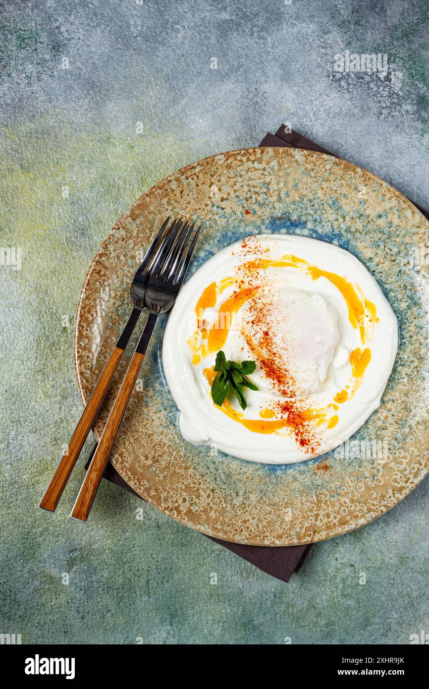 Cilbir, traditional Turkish breakfast, Turkish eggs with yogurt and ...