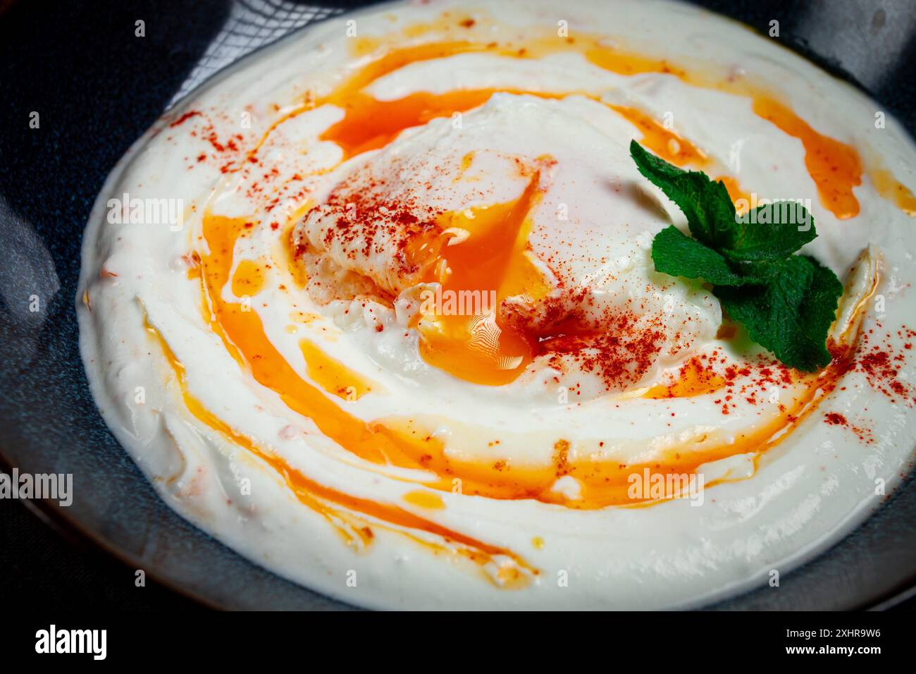 Cilbir, traditional Turkish breakfast, Turkish eggs with yogurt and ...
