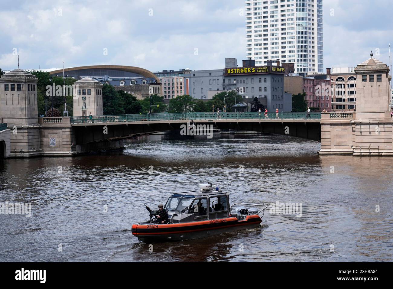 An armed security patrol moves in the Milwaukee near the Fiserv Forum ...