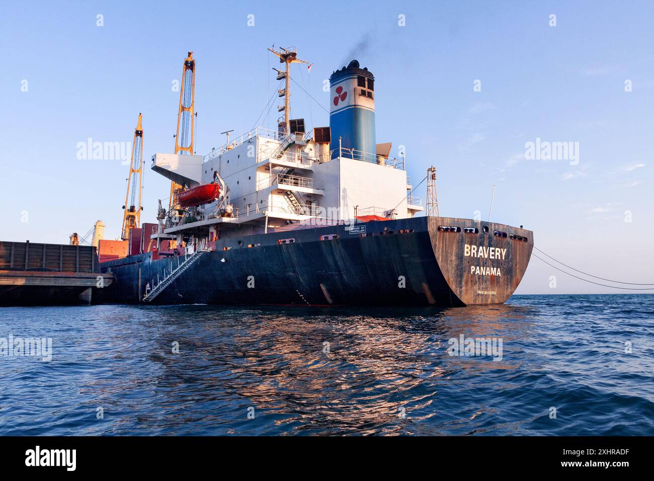 Borneo, Indonesia: A coal bulk carrier anchors offshore for coals at ...