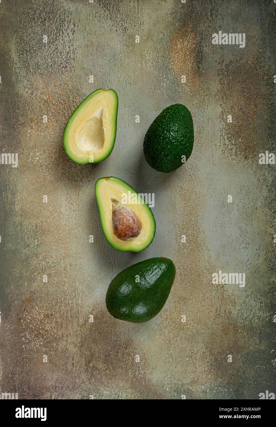 Fresh sliced avocado on the table, top view, food background, concept ...