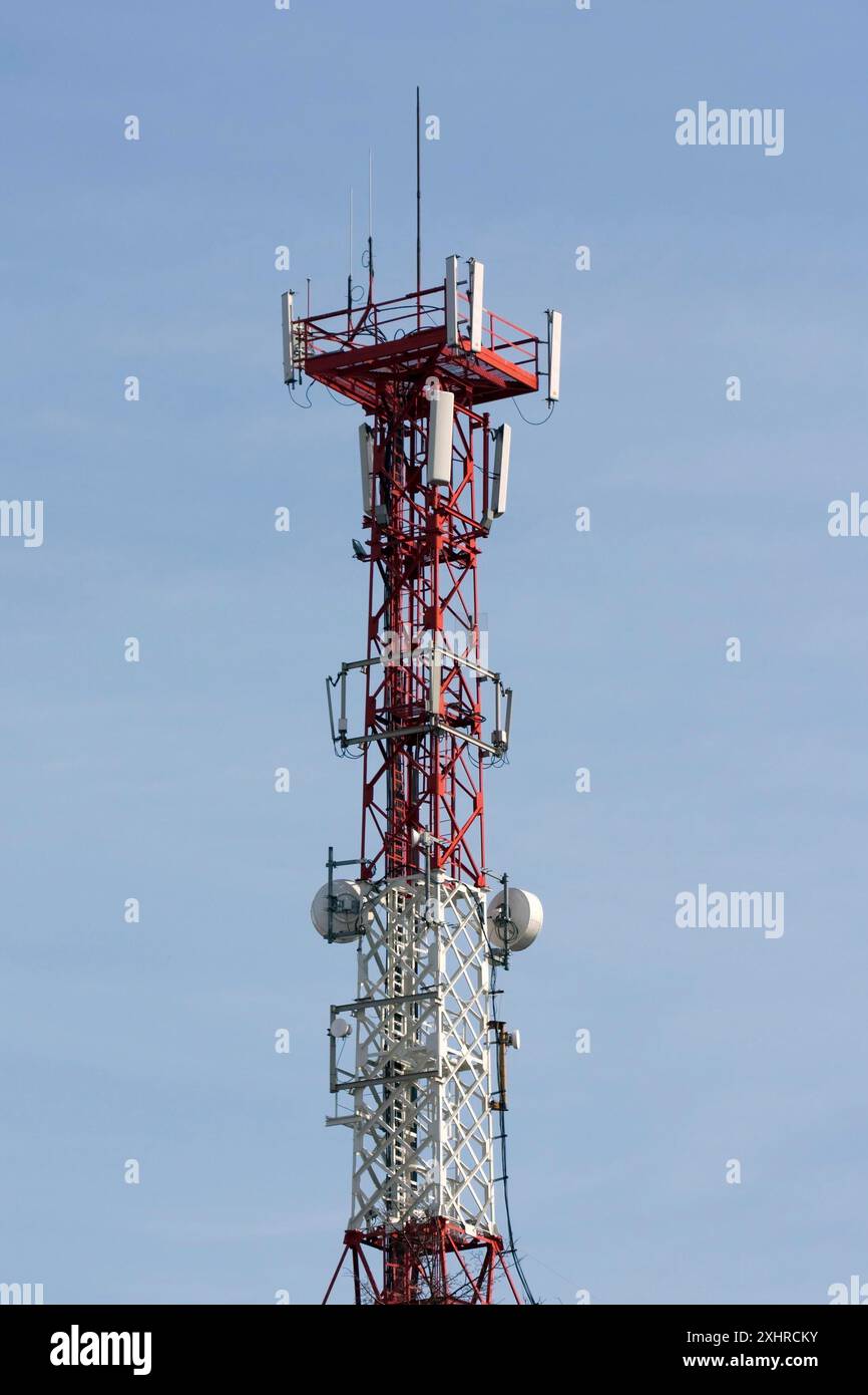 Communications antenna tower with repeater equipment Stock Photo - Alamy